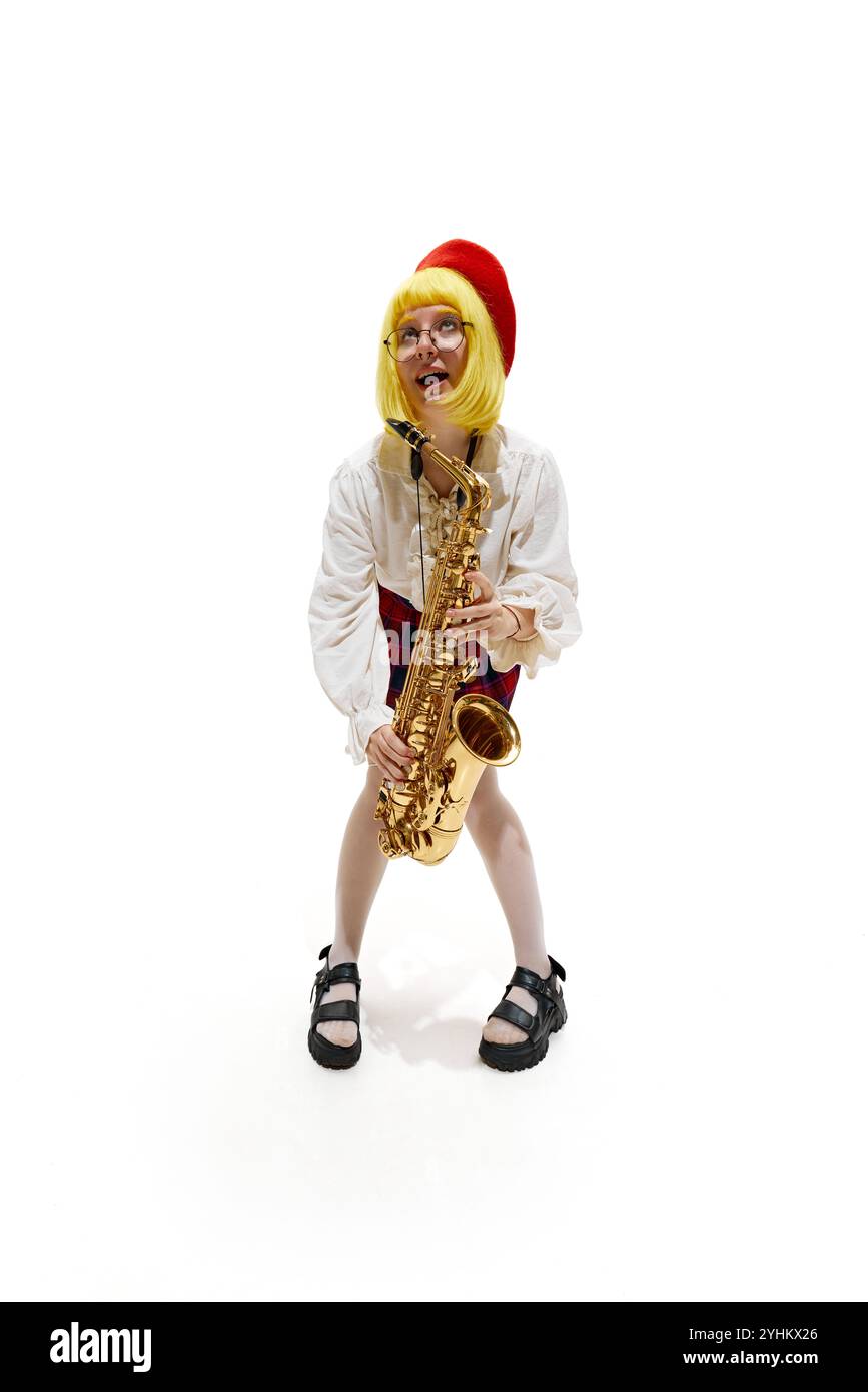 Woman with yellow wig and red beret, wearing plaid skirt, posing with ...