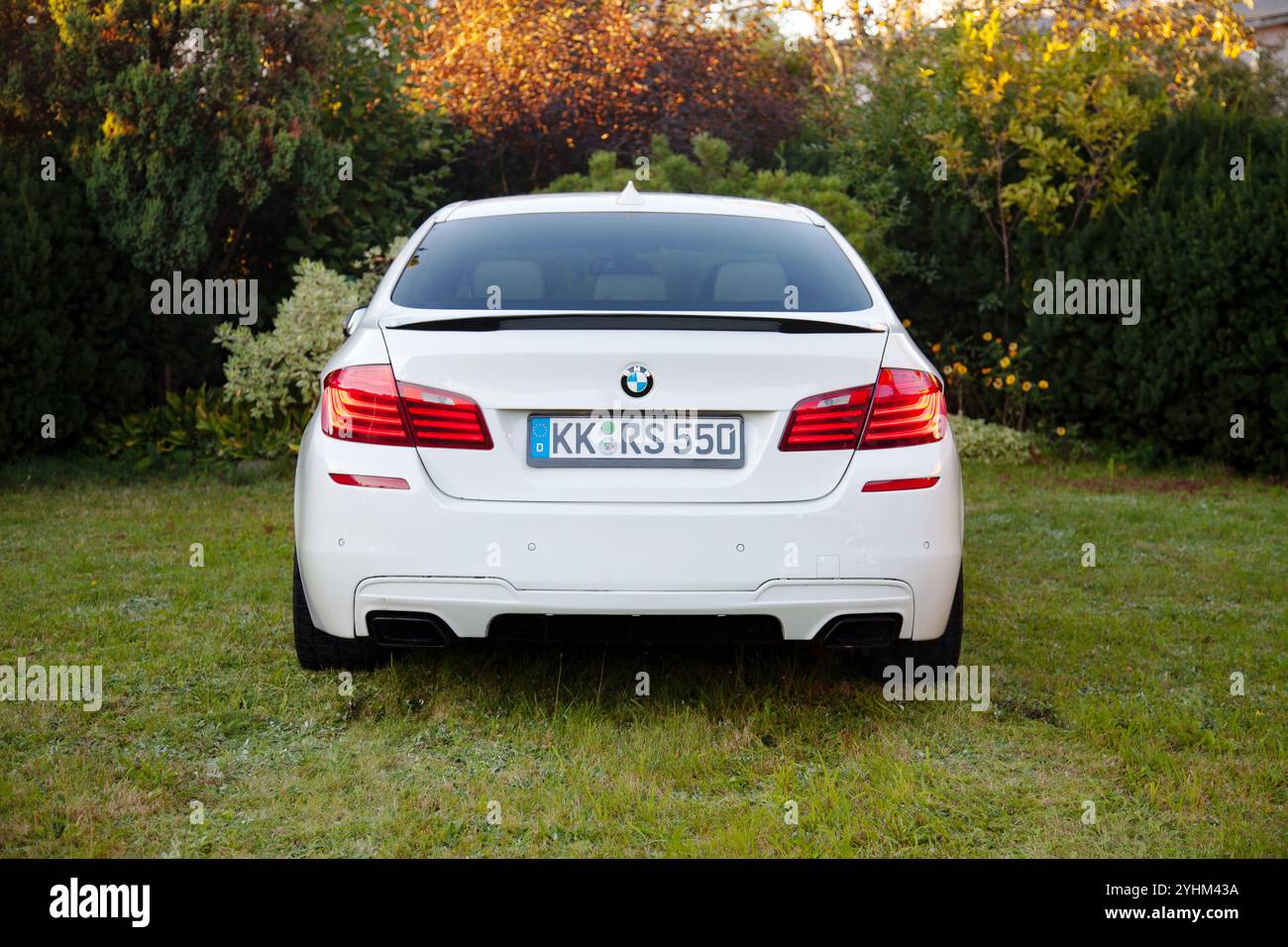 BMW rear view of white BMW 5 series M perfomance Stock Photo - Alamy