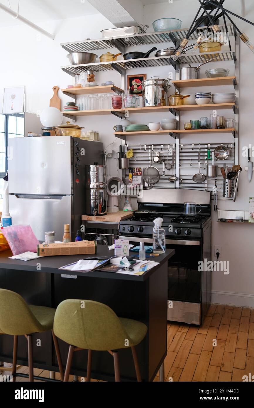 Cozy, modern kitchen with open shelving, kitchen utensils, and various ...