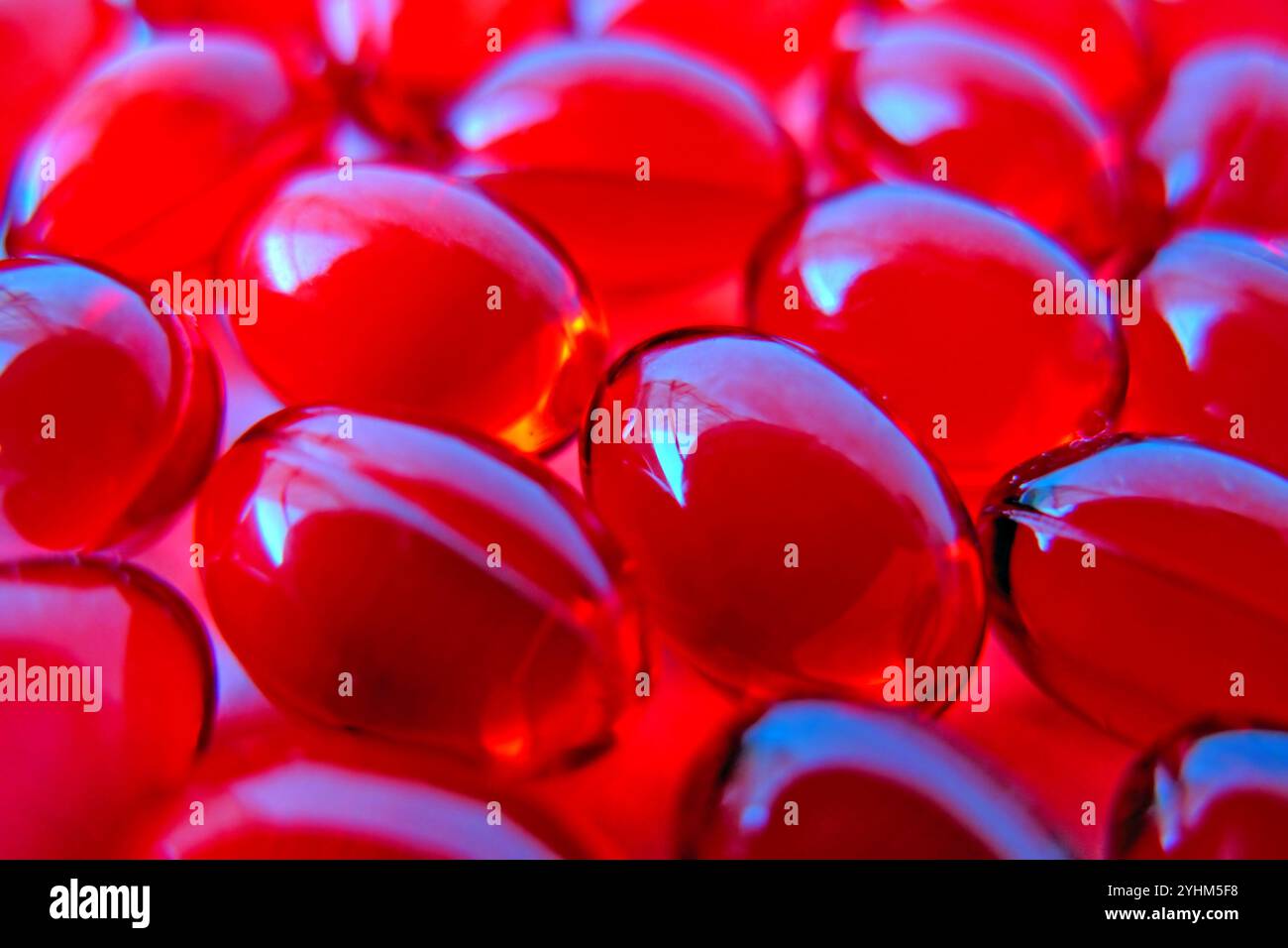red gel pills close up Stock Photo - Alamy