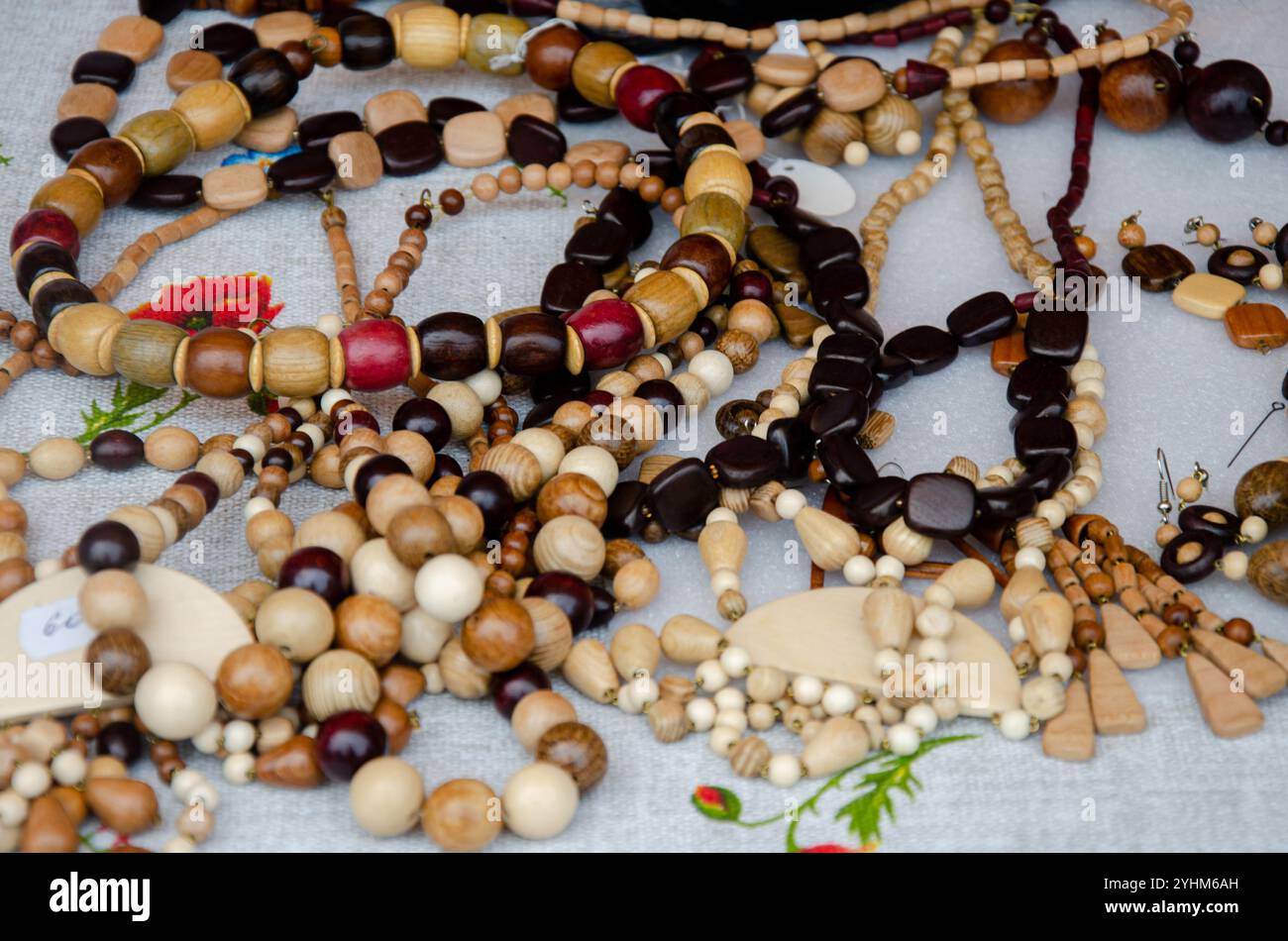 Decorative items made from beads and wood seeds Stock Photo - Alamy
