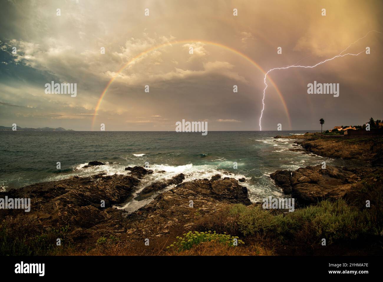 Rainbow and lightning opposite Saint-Aygulf, Var, France Stock Photo ...
