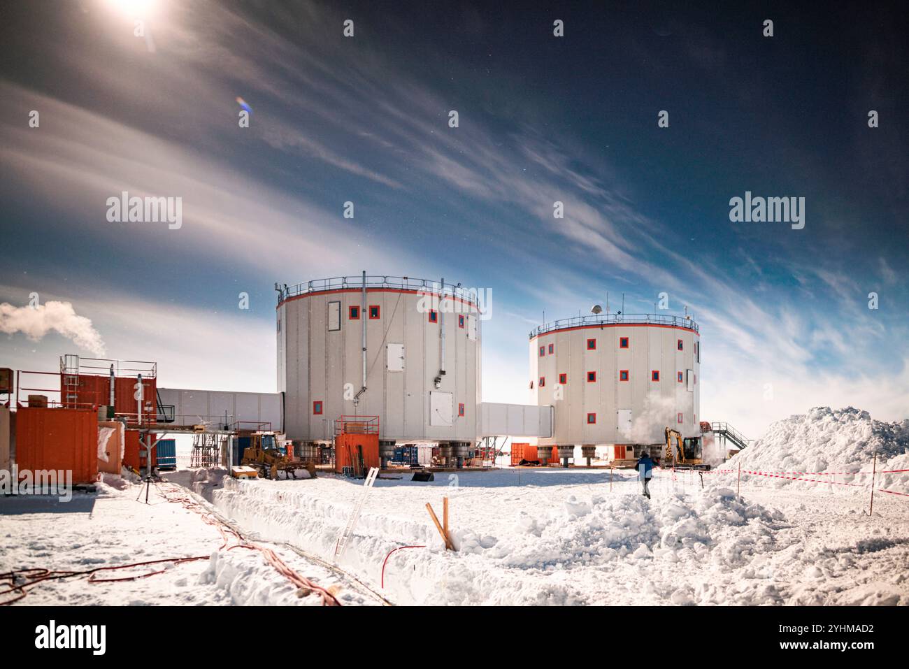The two towers and part of the power station; a trench dug in the snow, electrical cables laid ...