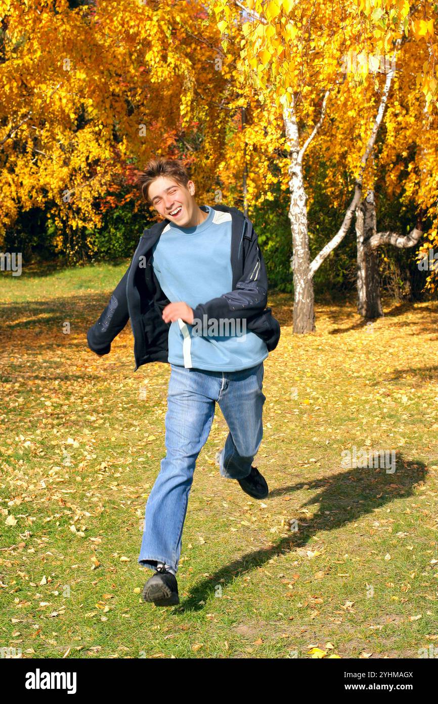 Male teen running in park hi-res stock photography and images - Alamy