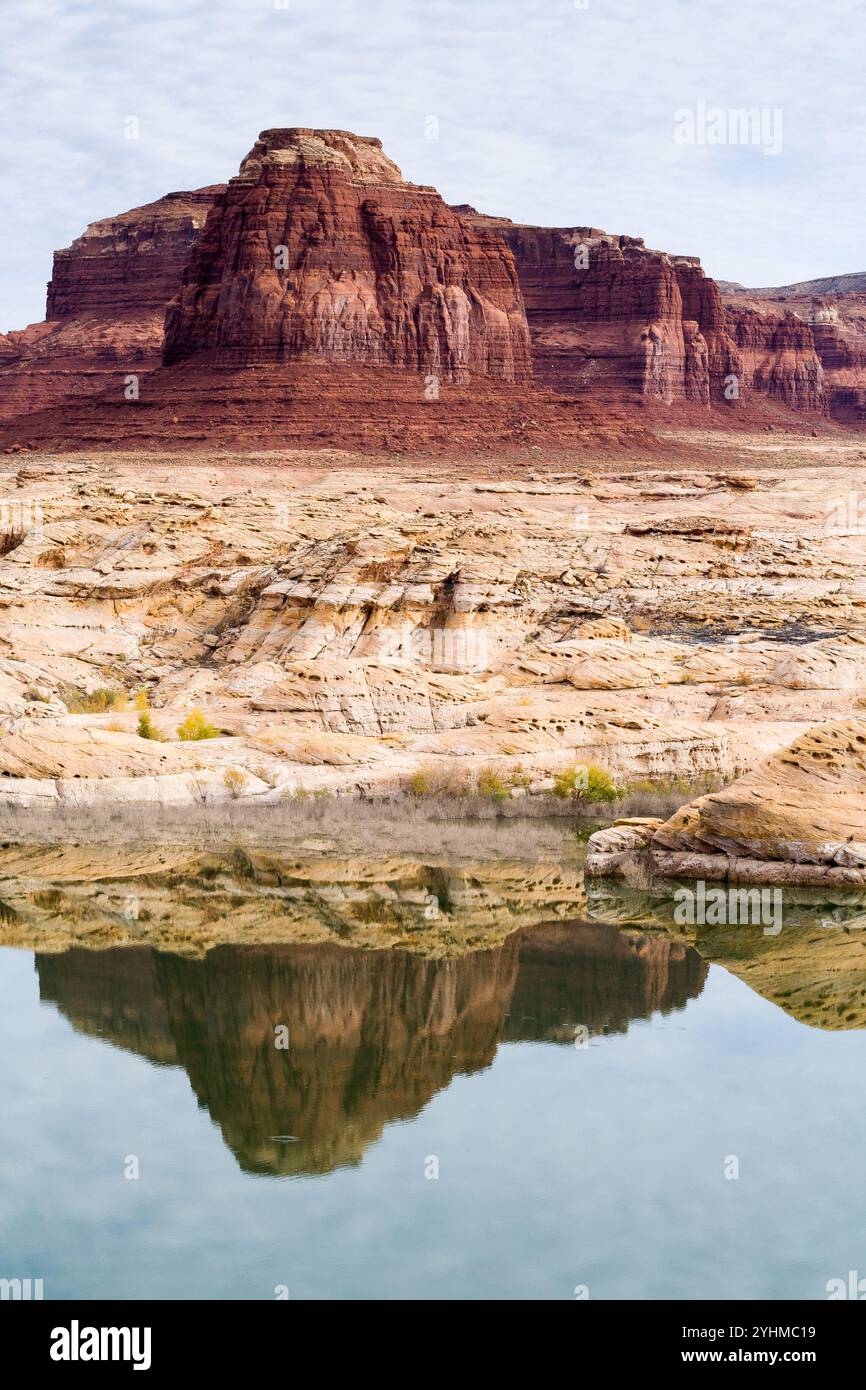 Sandstone buttes reflected in the calm waters of the Dirty Devil River ...