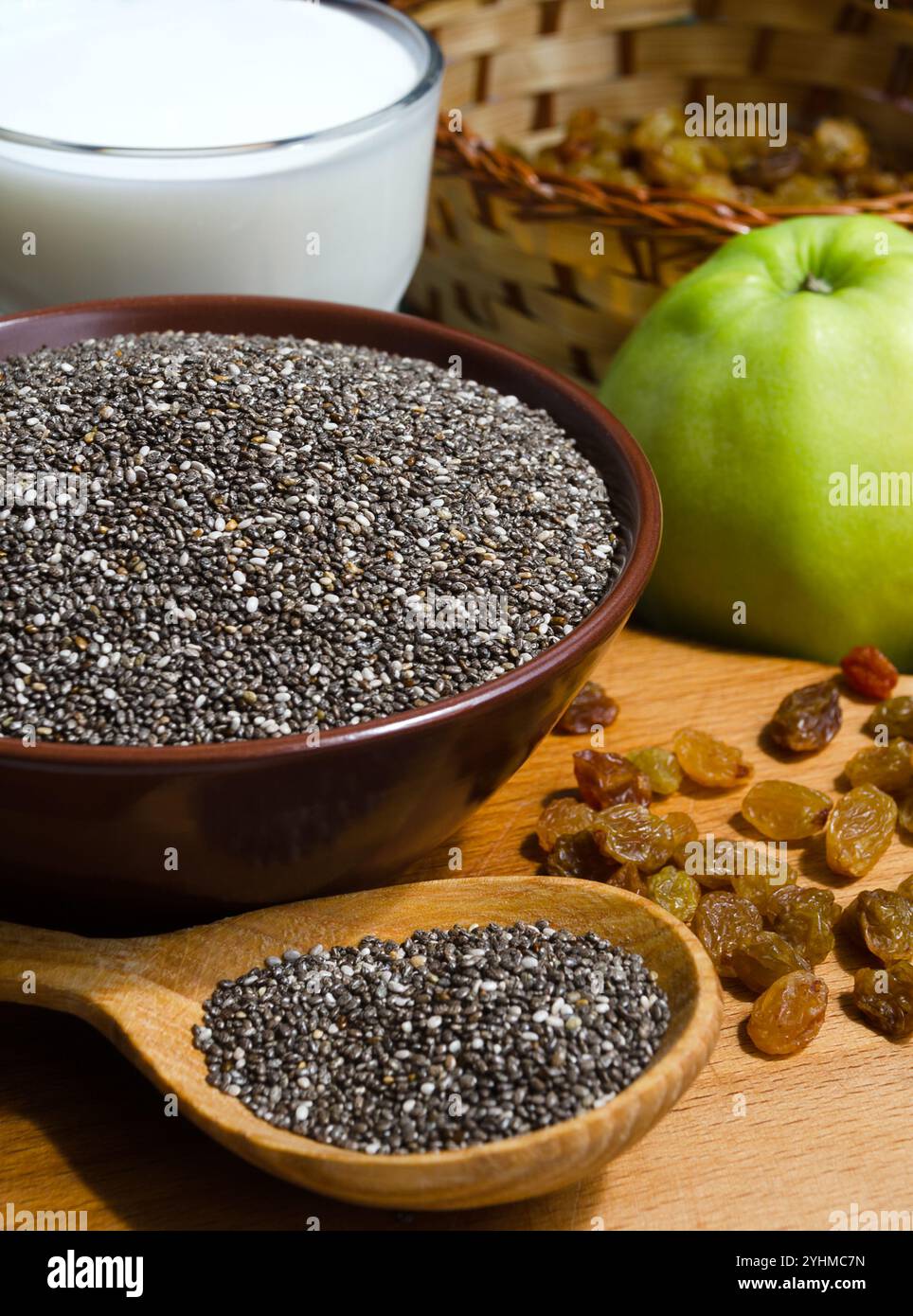 Chia in a bowl, raisins and yogurt. Chia is a plant of the Lamiaceae ...
