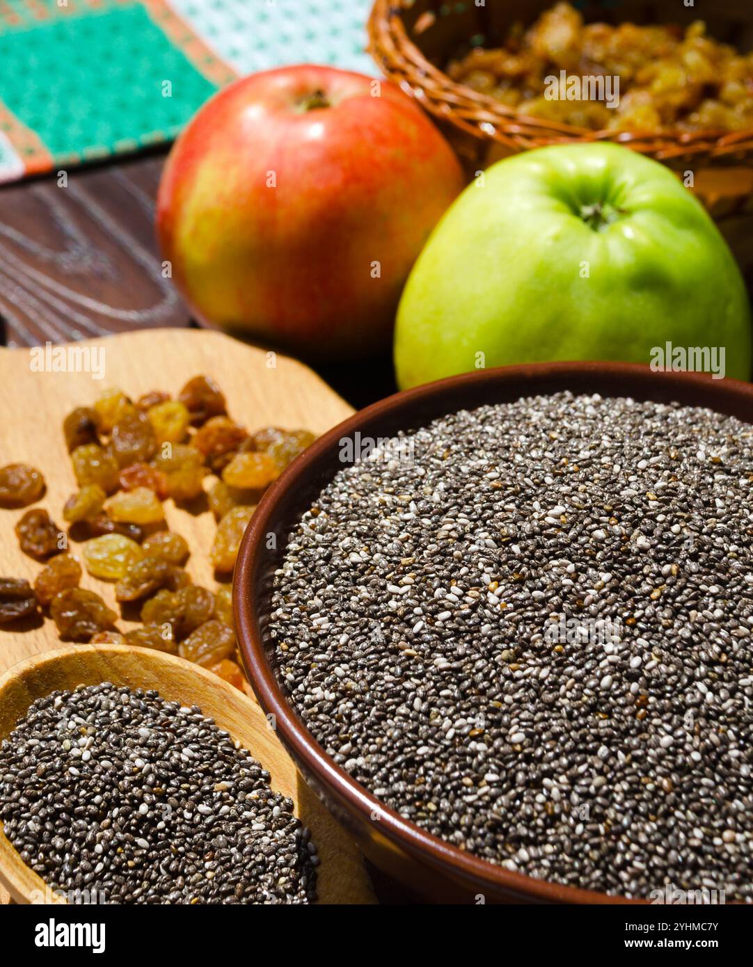 Chia in a bowl, raisins and yogurt. Chia is a plant of the Lamiaceae ...