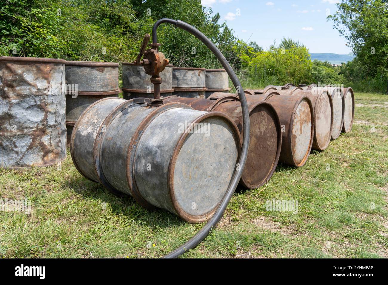Group old rusty barrels hi-res stock photography and images - Alamy