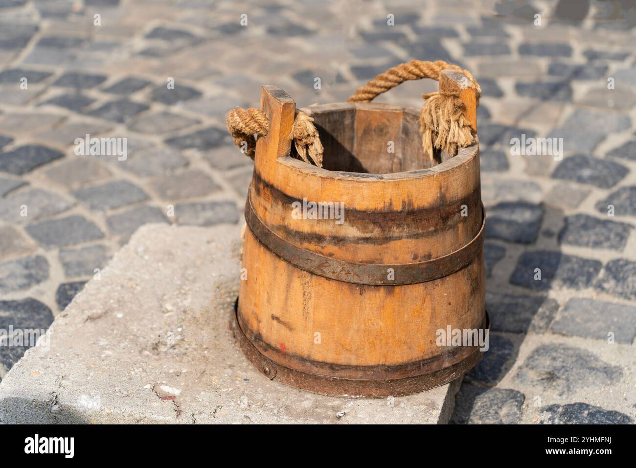 Rustic old wooden bucket with rope handle Stock Photo - Alamy