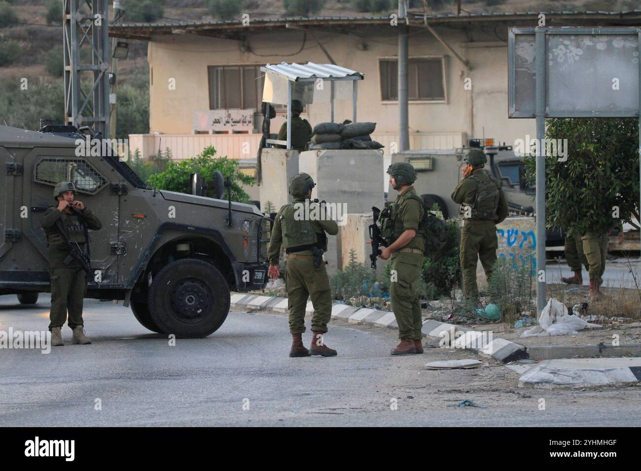 Israeli soldiers inspect the Shavei Shomron checkpoint after a ...