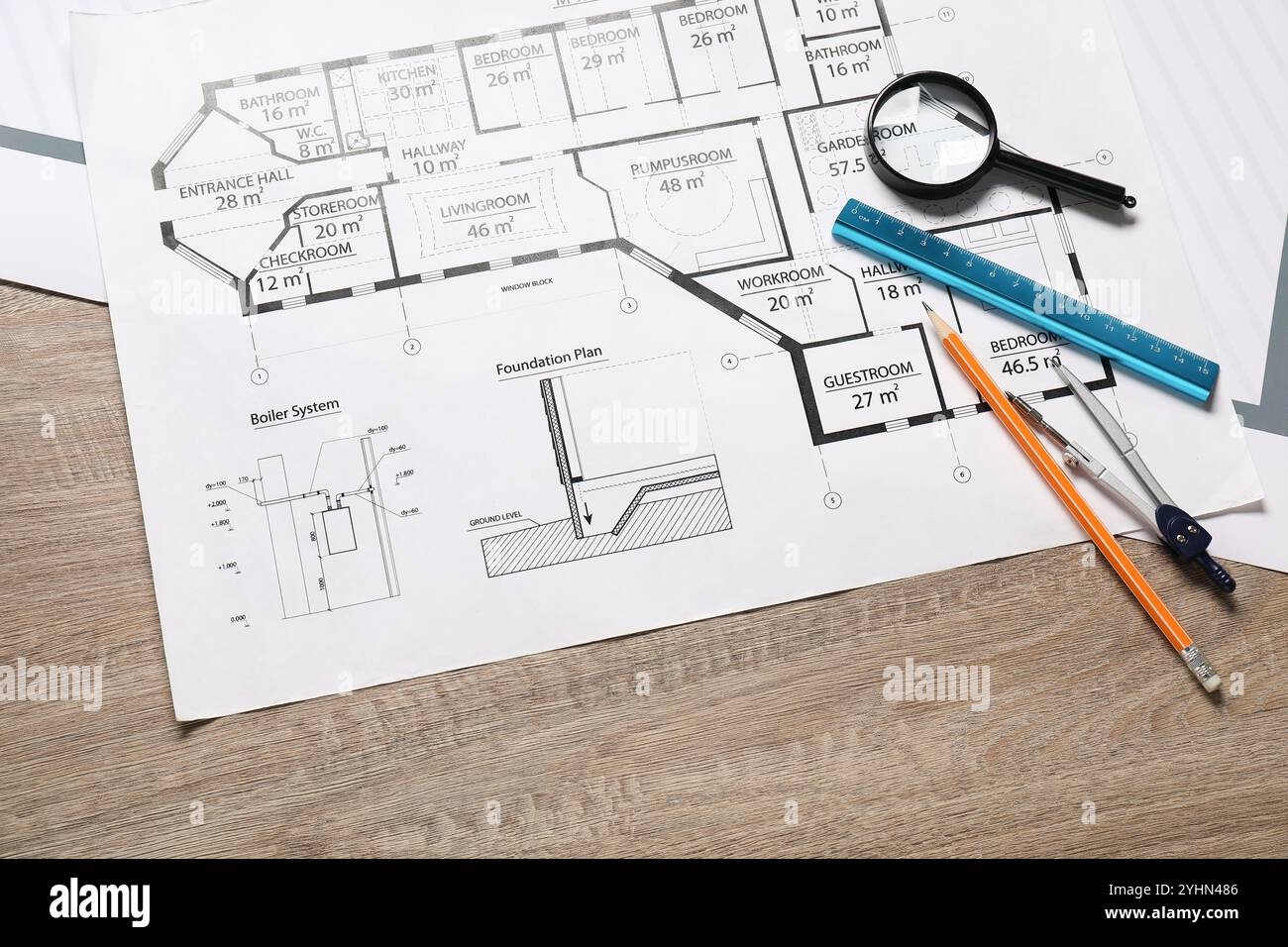 Different engineering drawings, pencil, dividers, ruler and magnifying ...