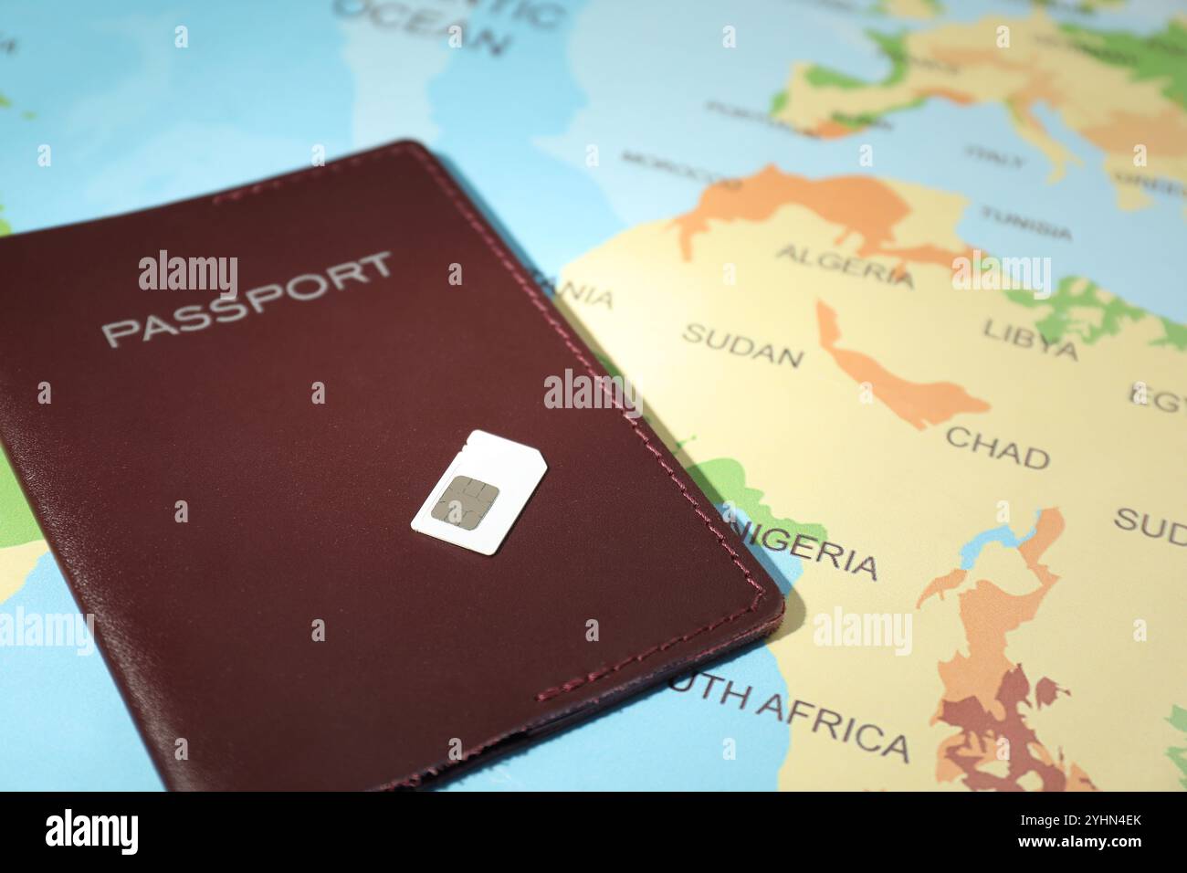 Modern SIM card and passport on world map, closeup Stock Photo - Alamy