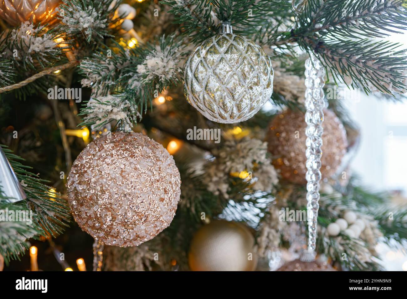 Elegant decor and garland with lights on beautifully styled Christmas ...