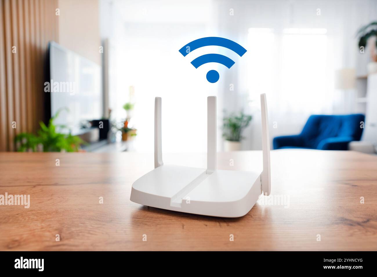 Modern wi-fi router on light table in living room Stock Photo - Alamy