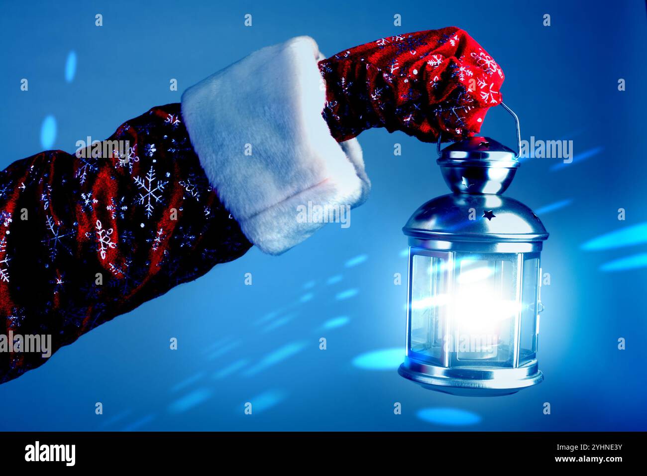 Santa claus holding shining lamp hi-res stock photography and images ...