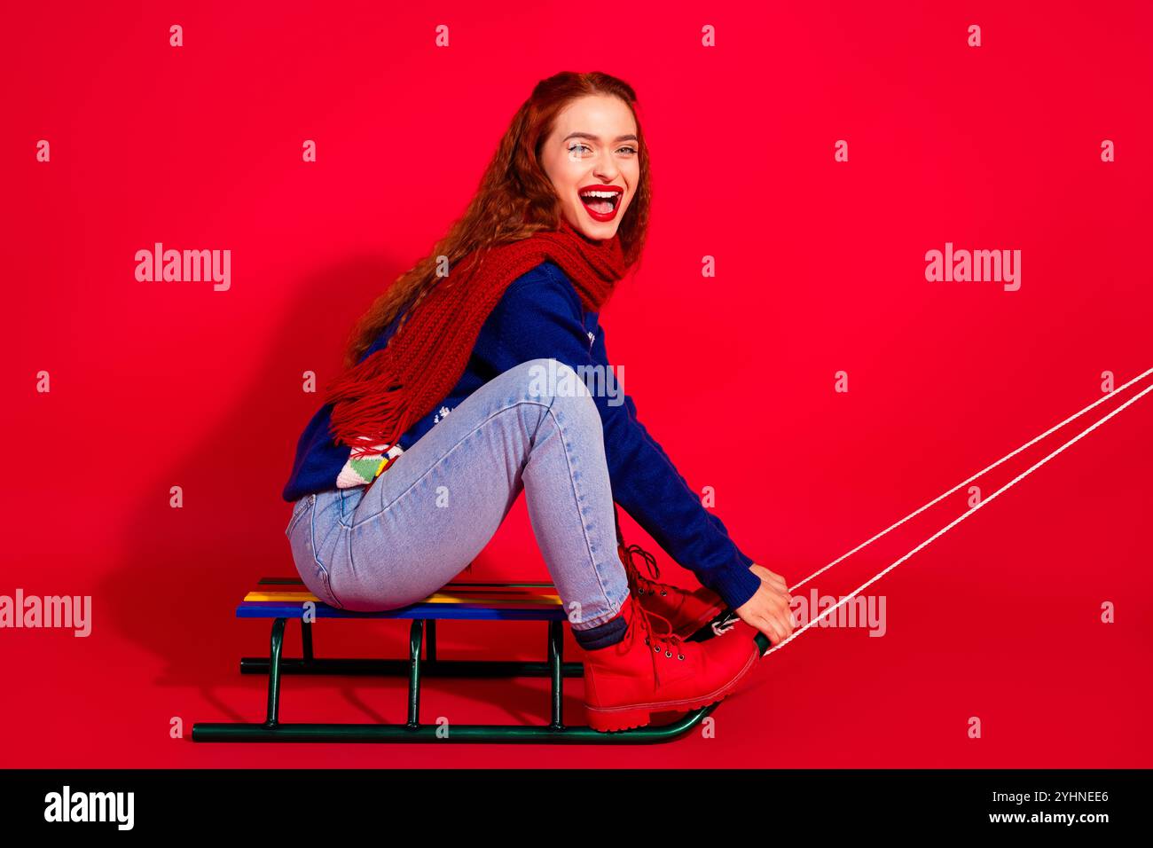 Full length photo of lovely young lady excited ride sledge dressed blue ...