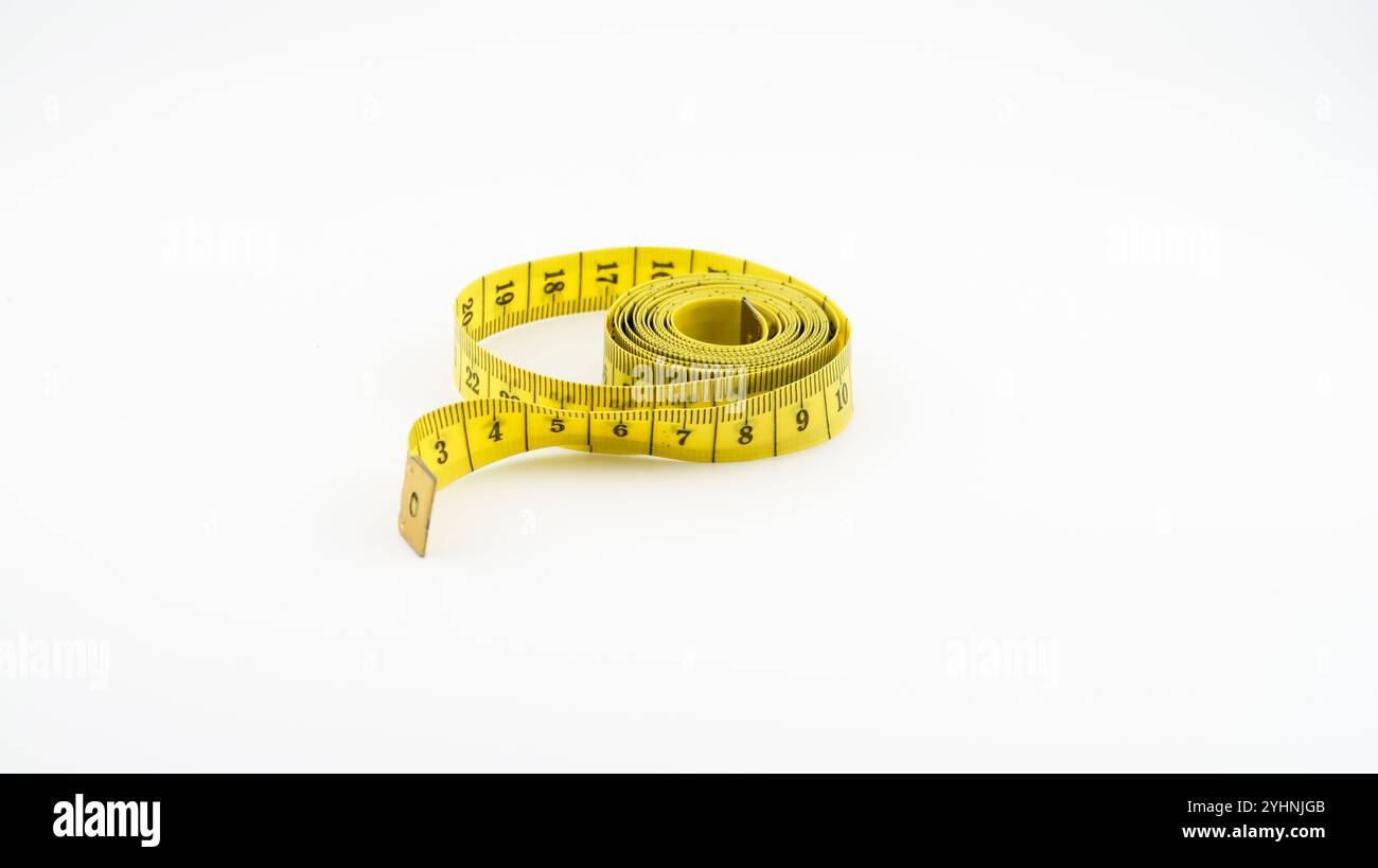 Loose metric measuring tape on white background Stock Photo - Alamy