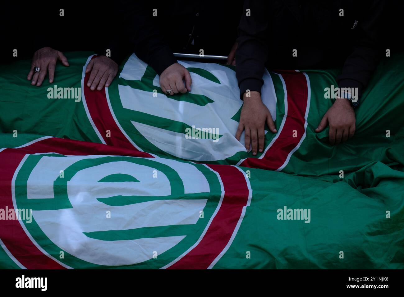 (EDITORS NOTE: Image depicts death)People lay hands on dead bodies ...