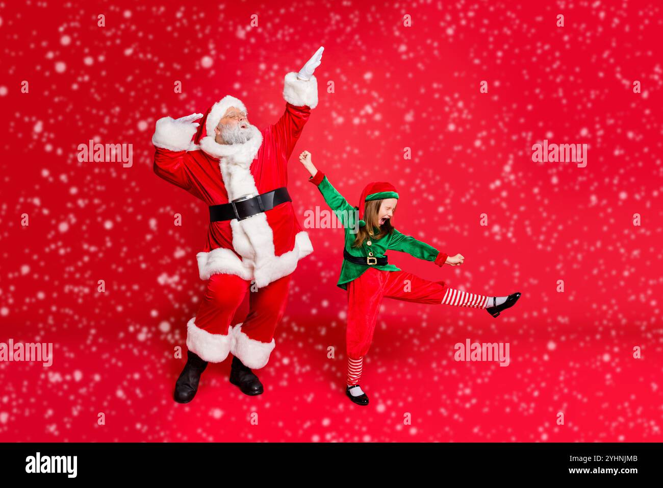 Full size photo of excited funny santa claus and elf with eyewear ...