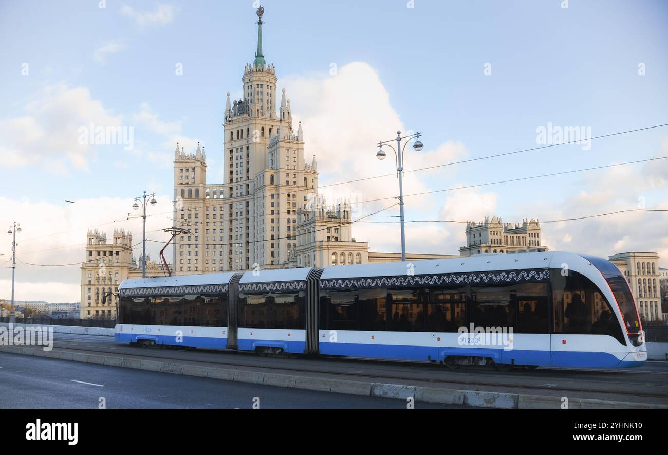 Tram traffic on the Bolshoi Ustinsky Bridge, view of a high-rise ...