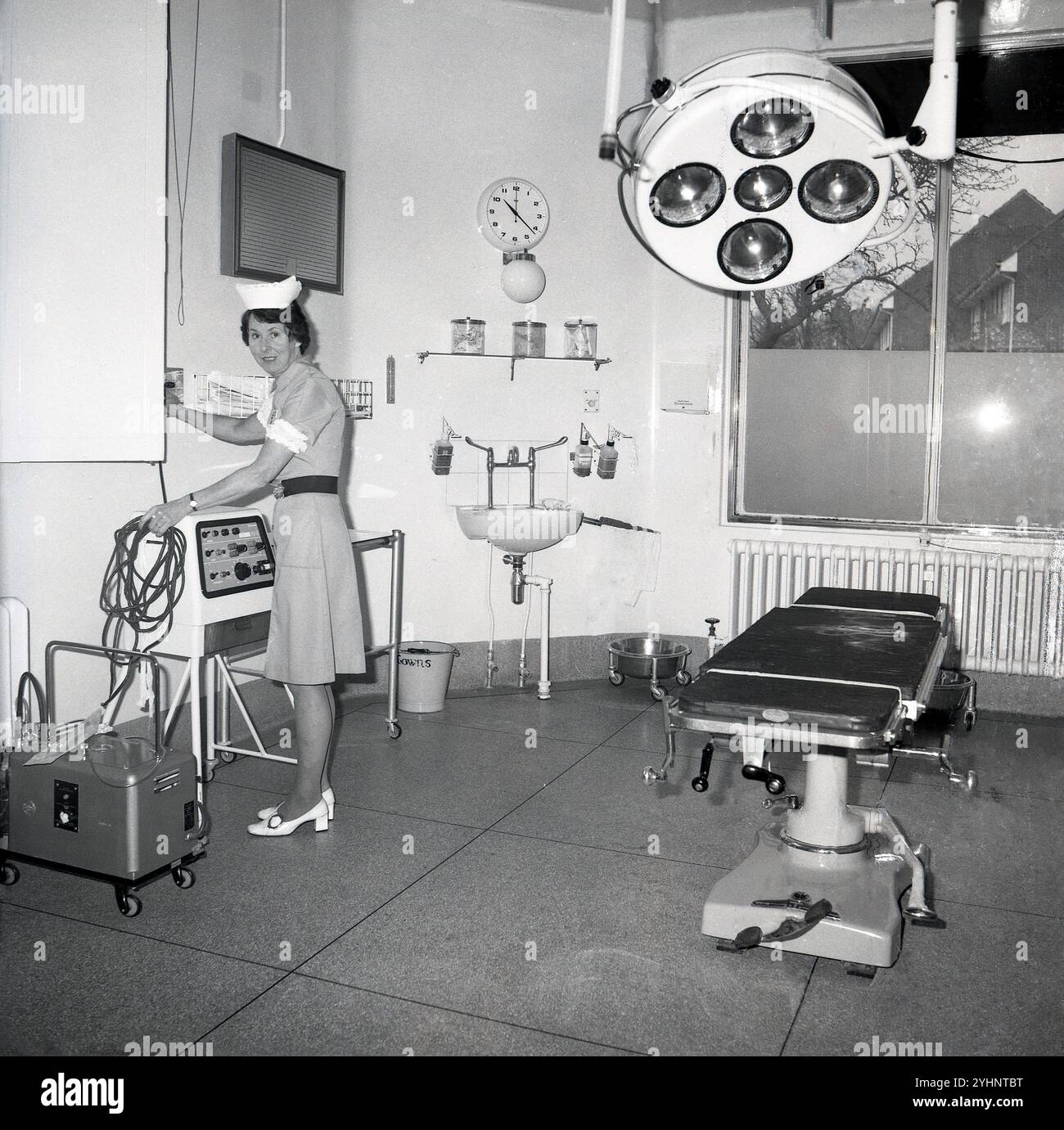 1979, historical, a theatre sister at work inside a hospital operating ...