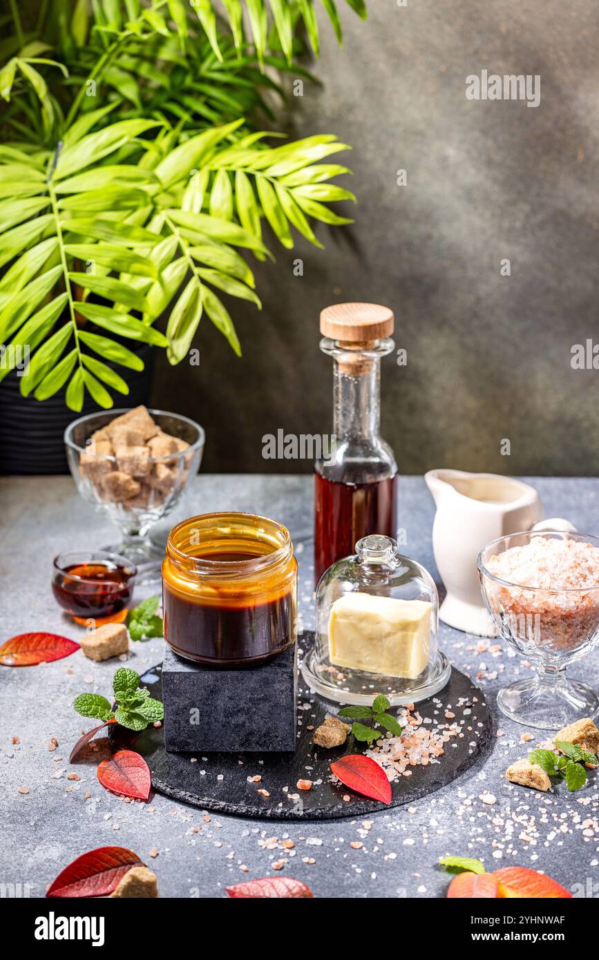 Glass jar of salted caramel sauce with ingredients like butter, brown ...