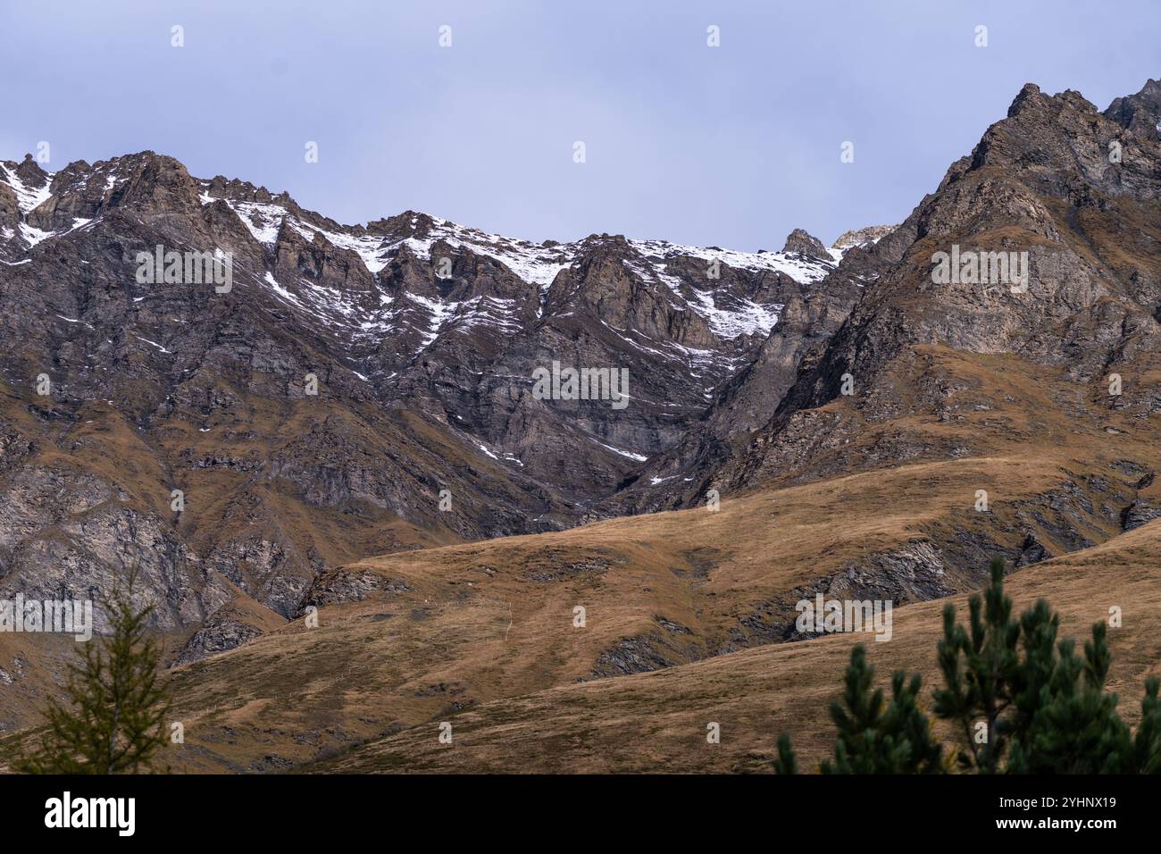 mountain range panorama with snow caps in autumn, details of rock face ...