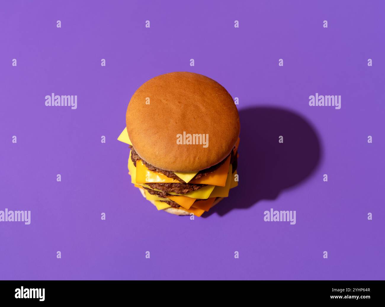 Cheeseburger with multiple layers of beef patties and cheese, isolated ...