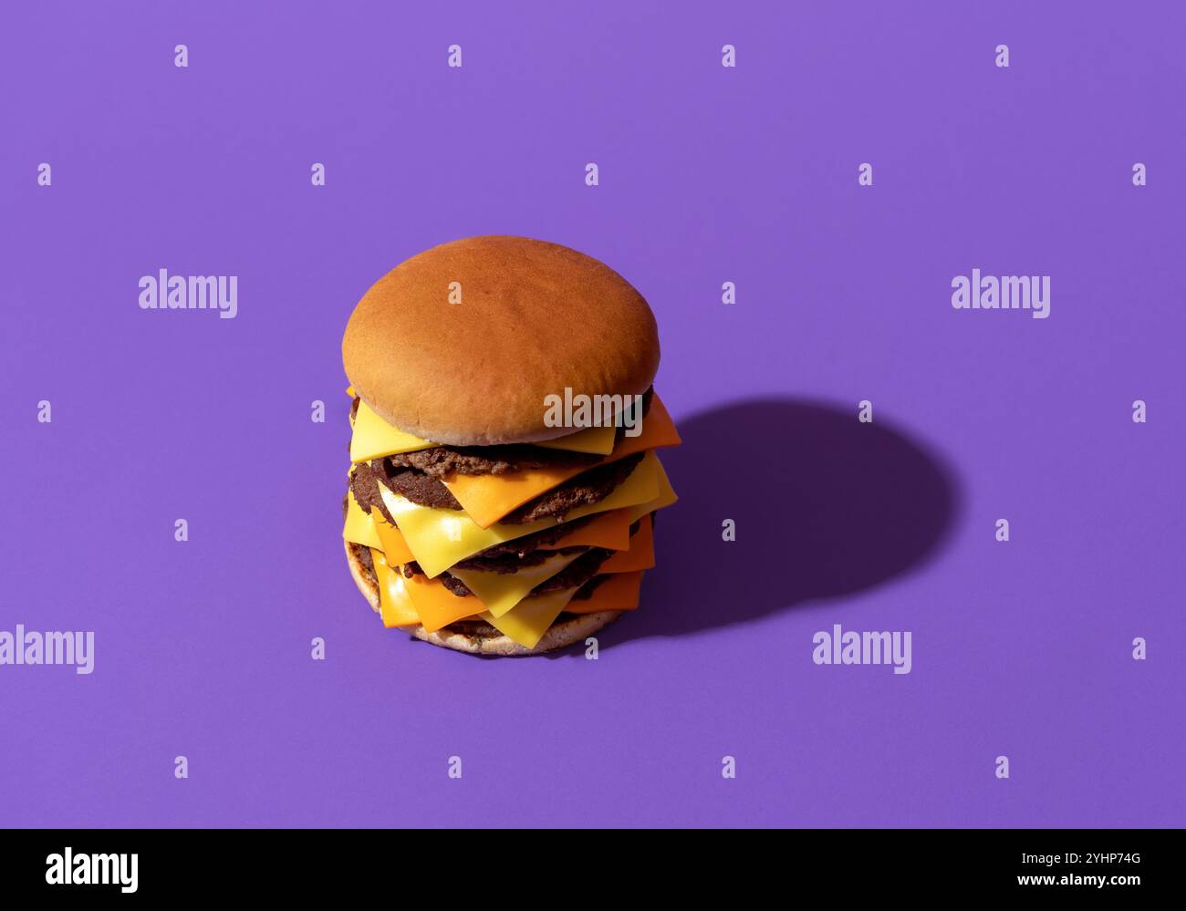 Cheeseburger with multiple layers of beef patties and cheese, isolated ...