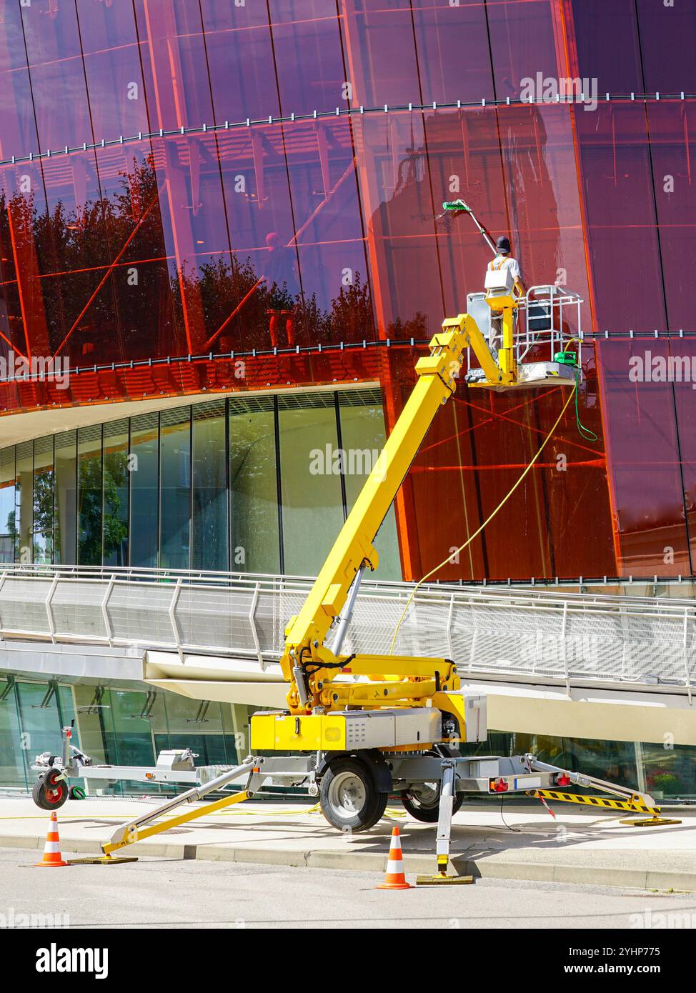 Glass facade cleaning works of a modern building using a modern self ...