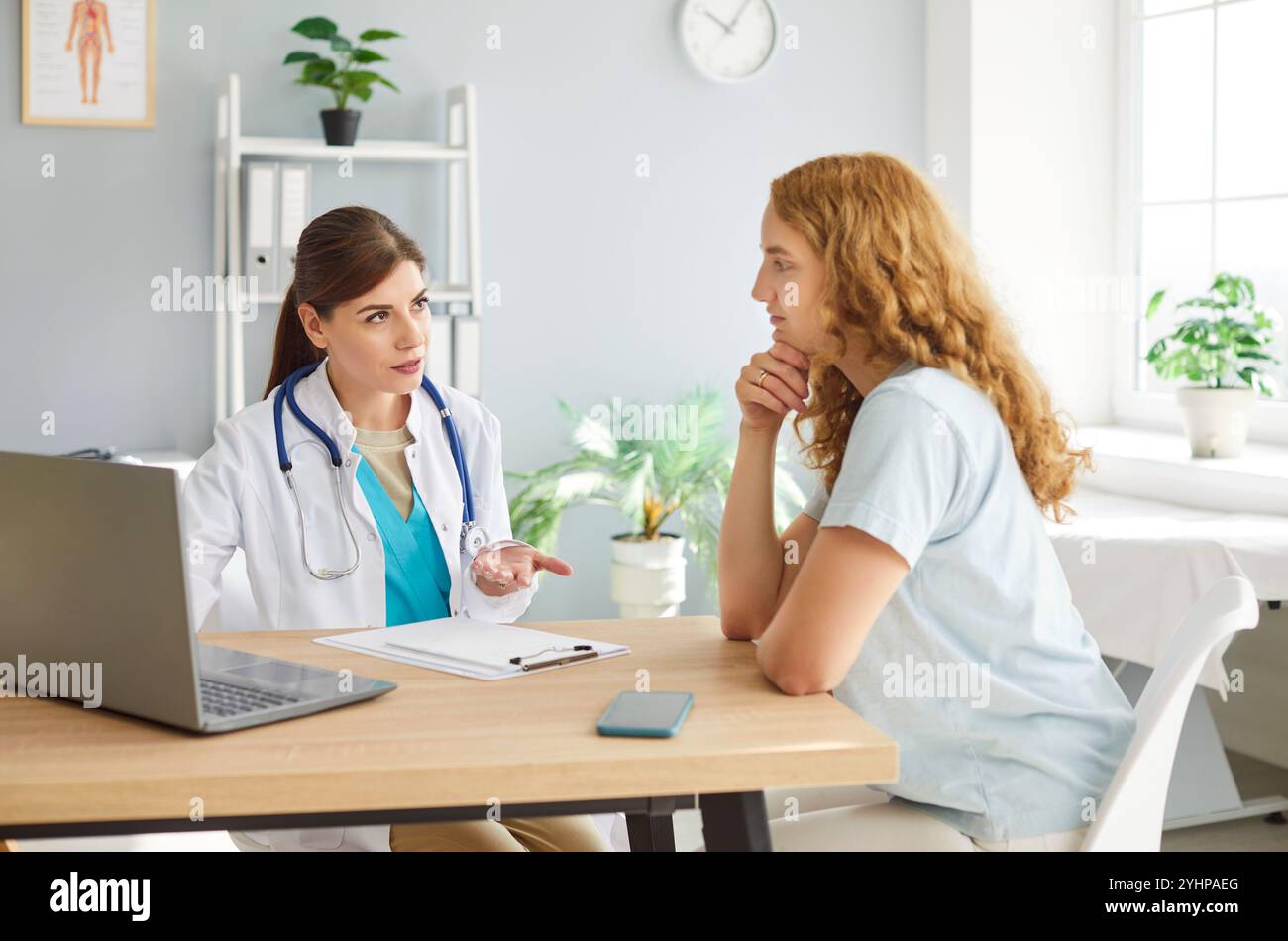 Female therapist near digital laptop showing health test check up ...