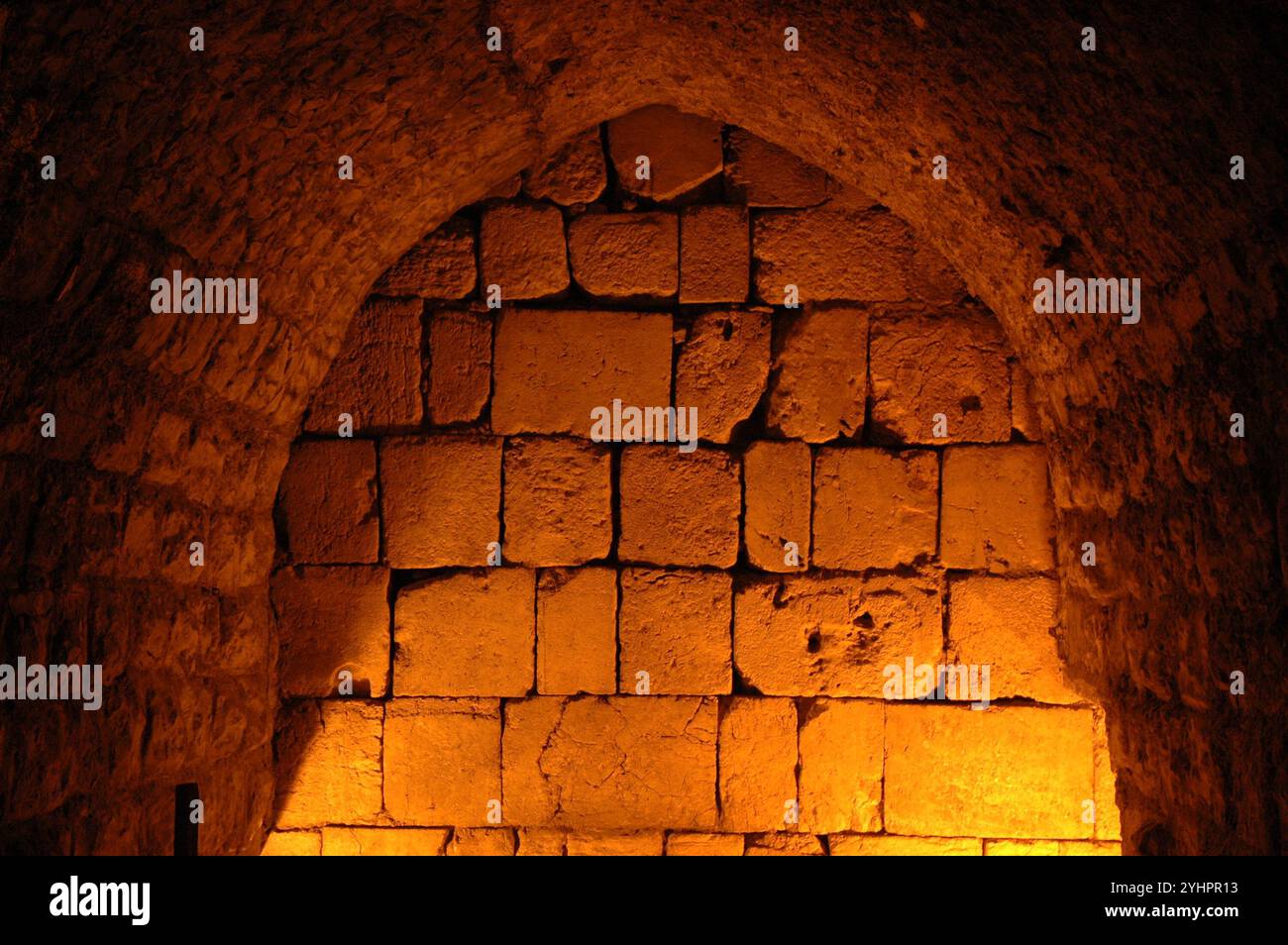 Ancient stone archway in the tunnels located beneath the Western Wall holy site in Jerusalem ...
