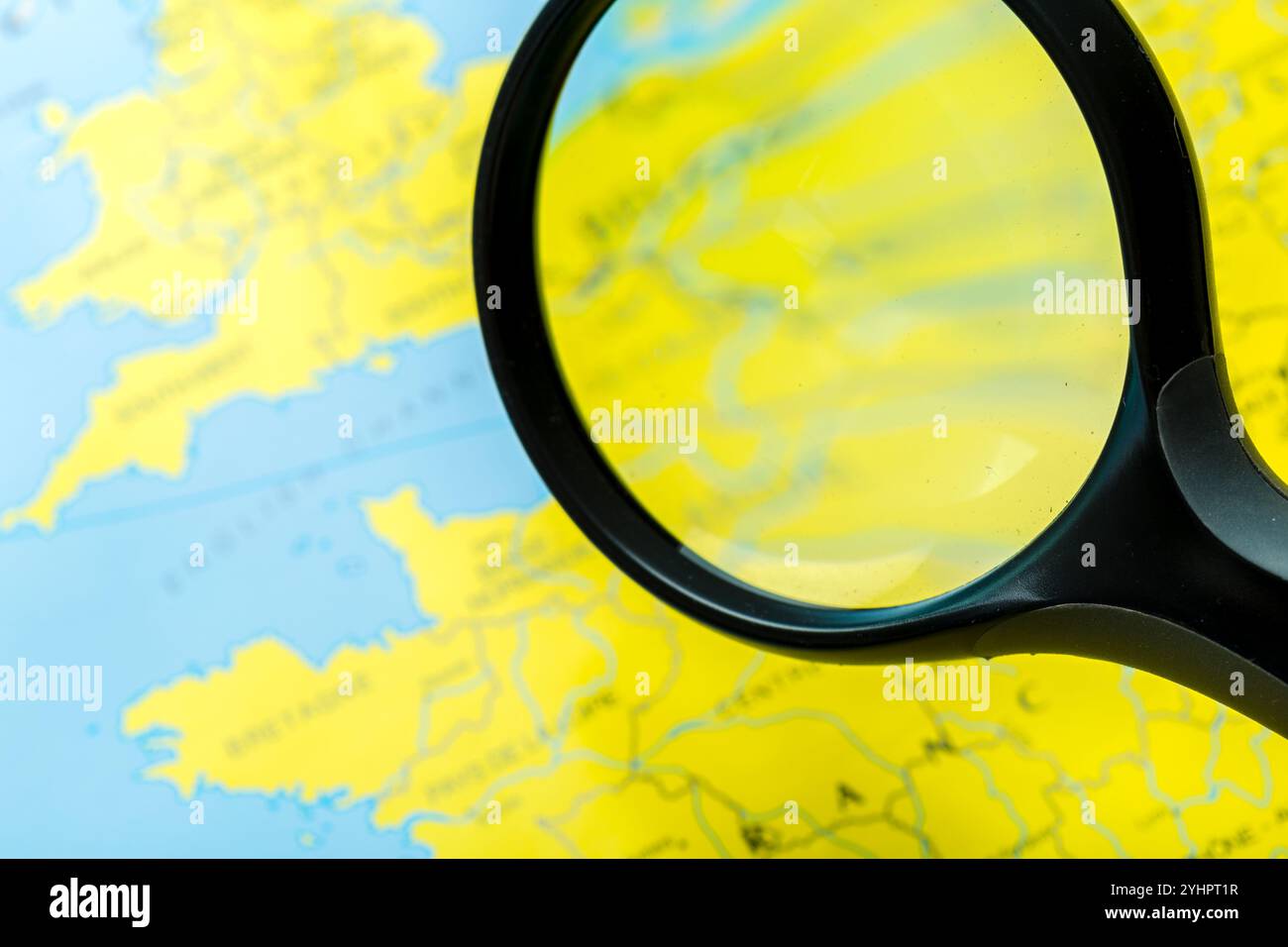 Magnifying glass and map Stock Photo - Alamy