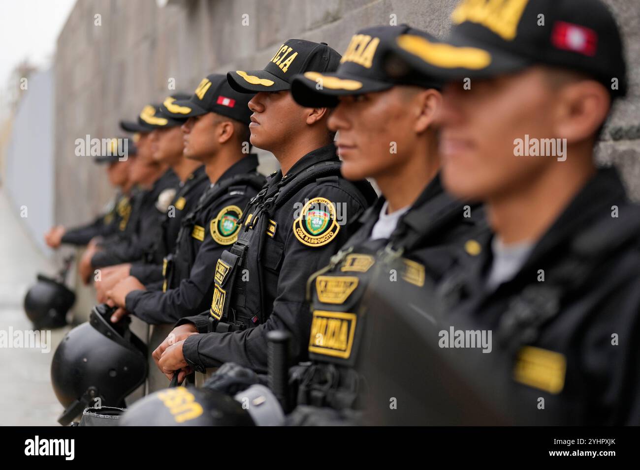 National police officers stand guard on the perimeters of the Ministry ...