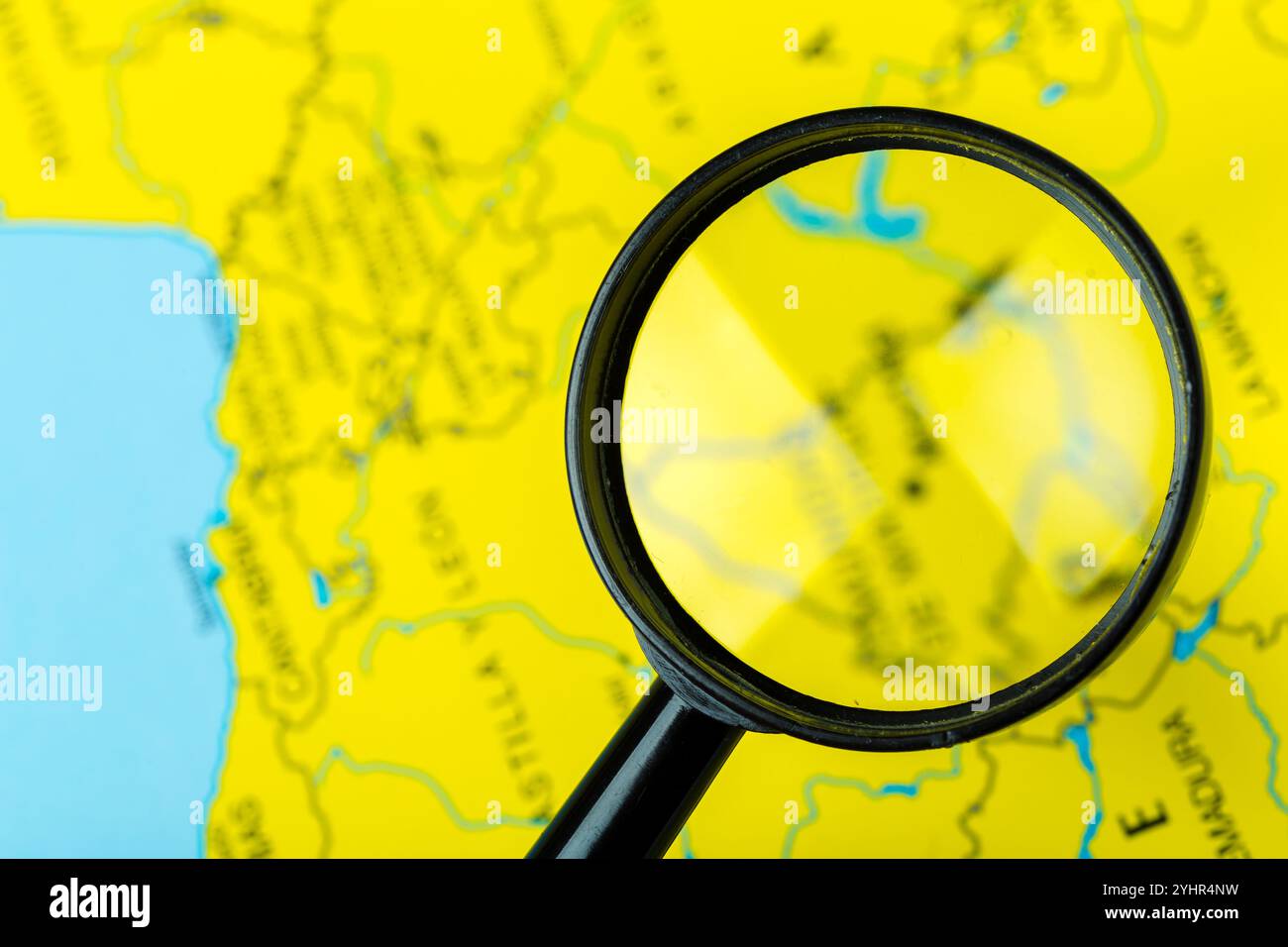 Magnifying glass and map Stock Photo - Alamy