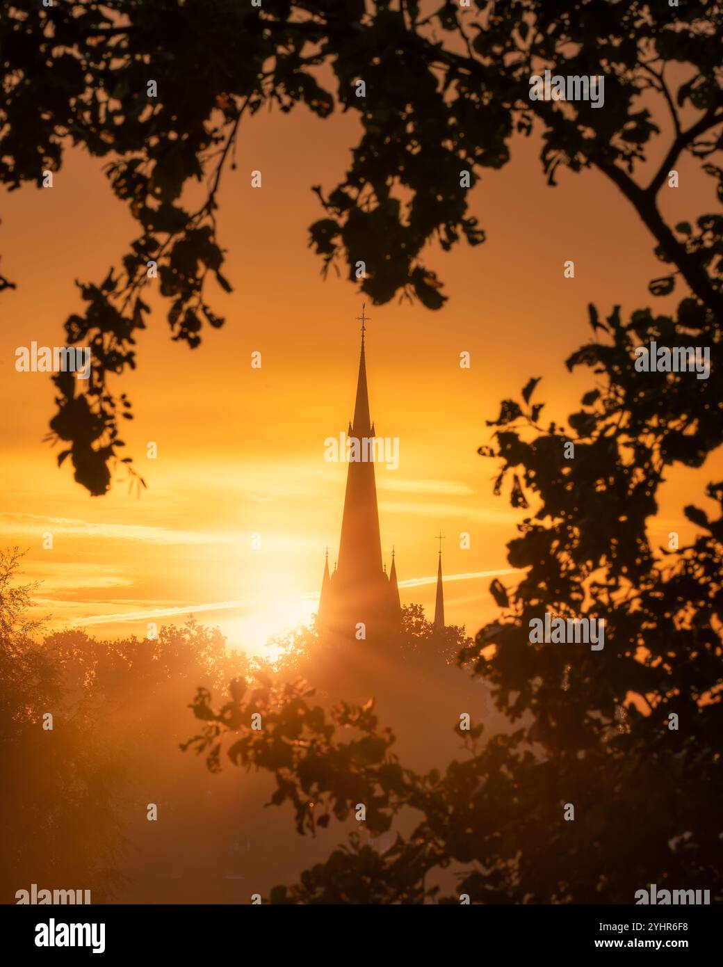 Golden Sunrise Over Church, Netherlands: A Glowing Steeple Through ...