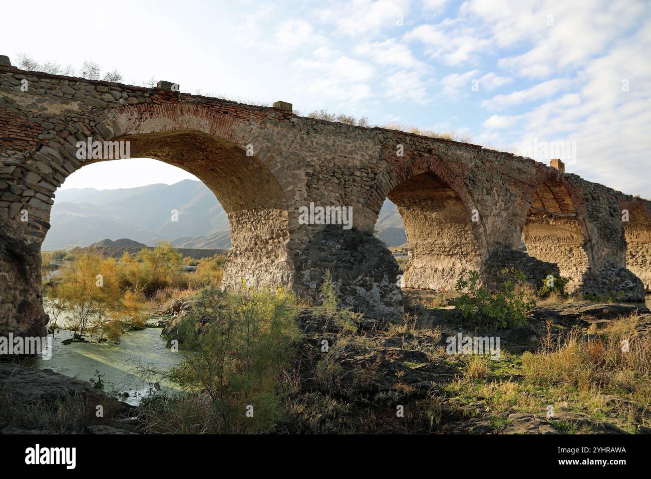 Historic Khudafarin Bridge which spans the Aras River at the border of ...