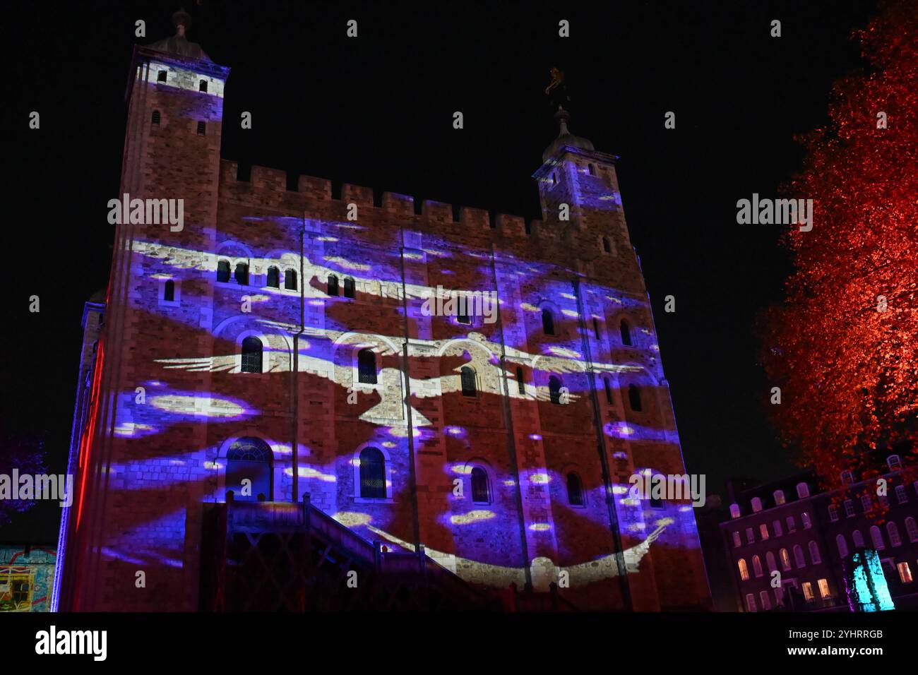 The White Tower keep in the Tower of London lit up during the Poppy ...