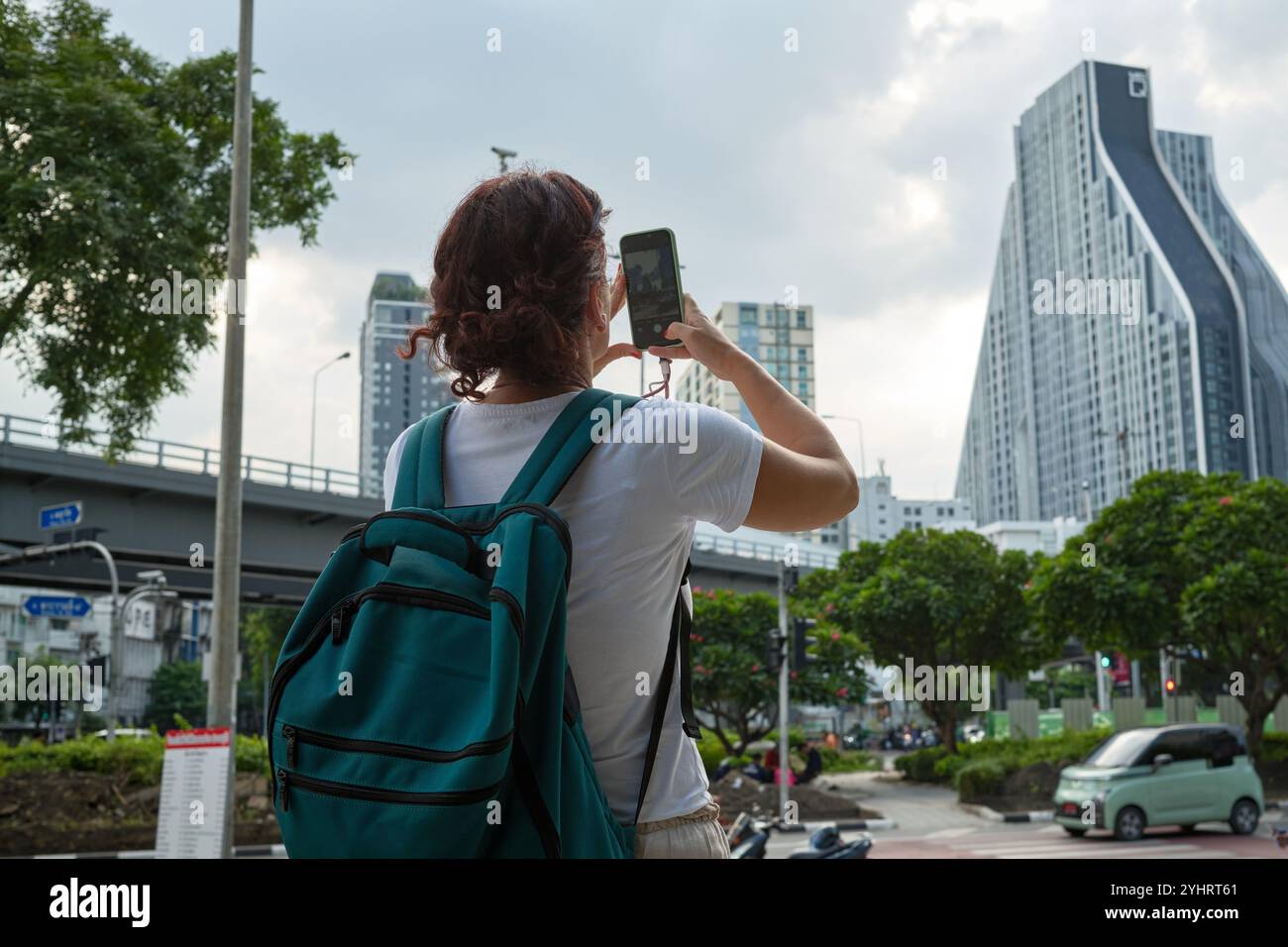 Tourist taking pictures of bangkok skyscrapers with smartphone Stock ...