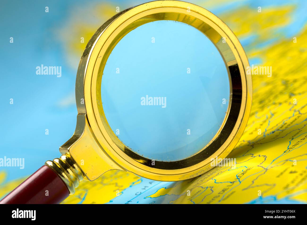 Magnifying glass and map Stock Photo - Alamy