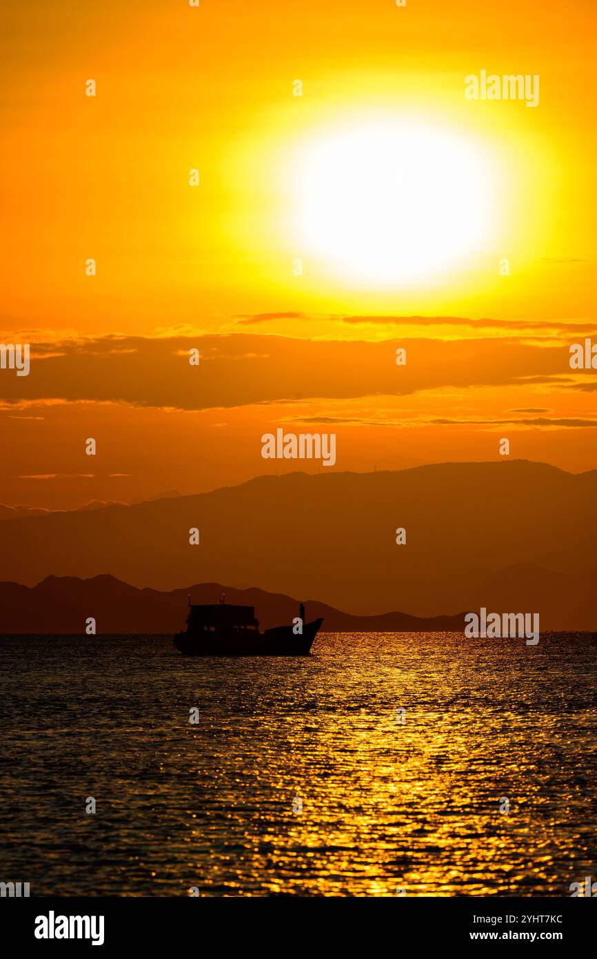 Komodo National Park Sunset with the Silhouette of a Boat on Flores ...