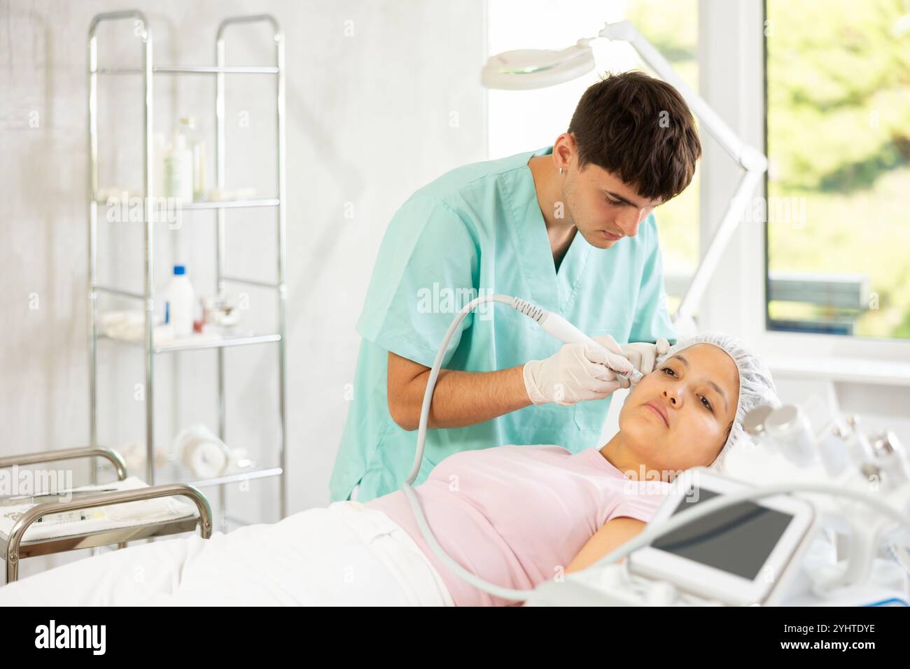 Using device and hydrogen oxygen cleaning attachment Stock Photo - Alamy