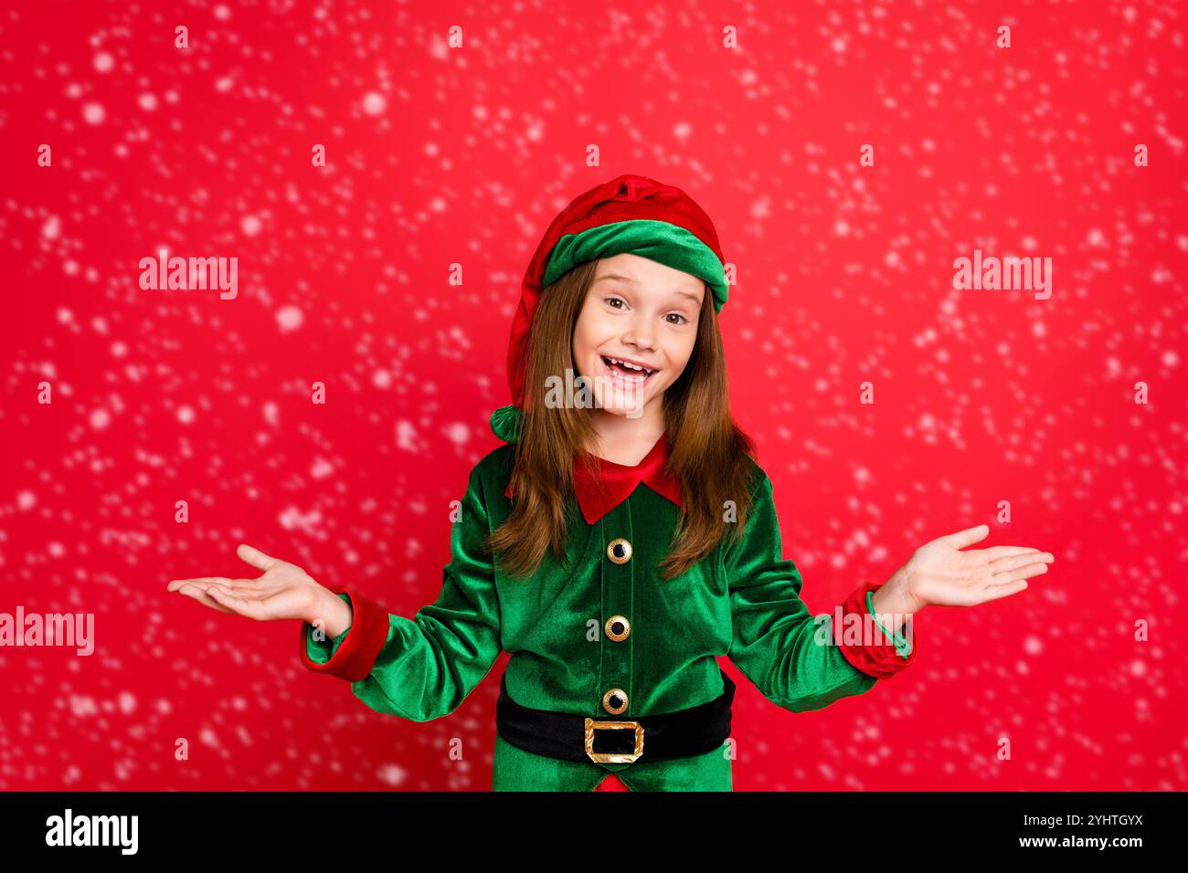 Portrait of lovely elf child holding her hands smiling offering ads ...