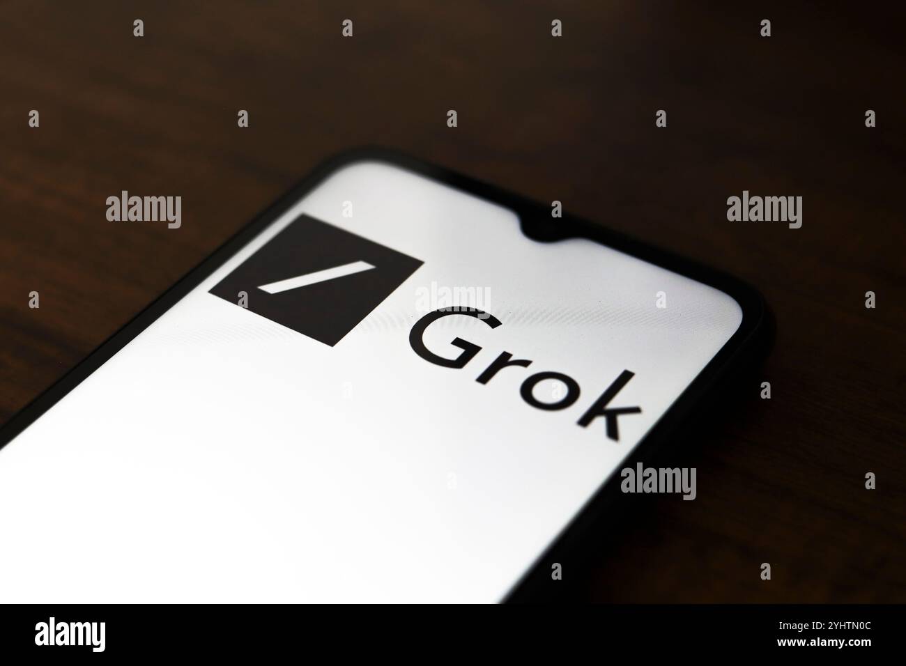 The Grok logo is displayed on the screen of a smartphone, in Reno ...