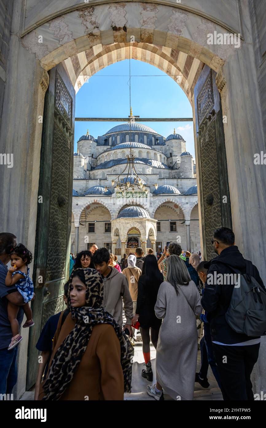 24/10/2024. The Blue Mosque, Istanbul, Turkey. Visitors enter and exit ...