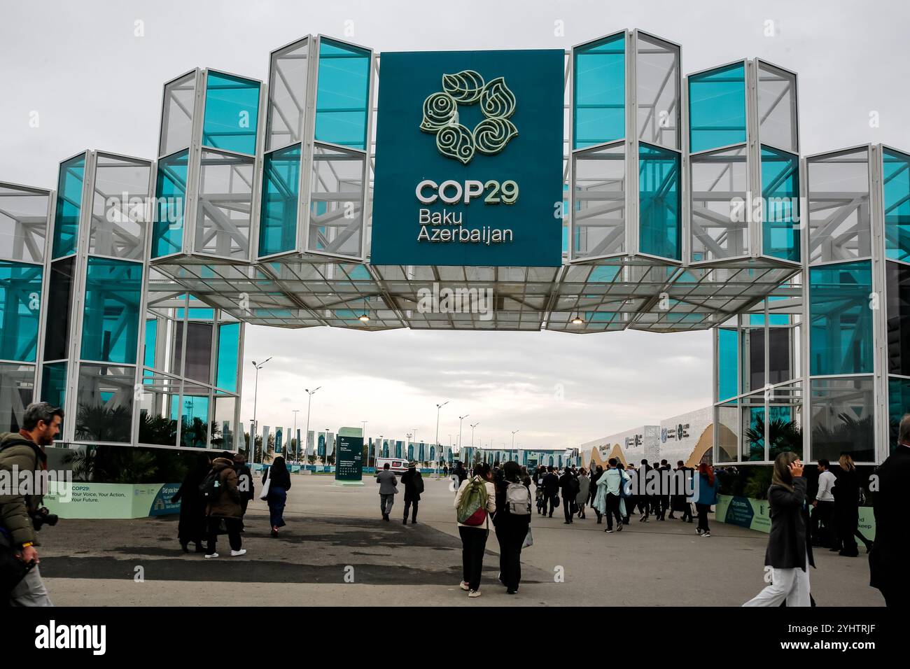 Baku, Azerbaijan. 12th Nov, 2024. Participants walk by an entrance of ...