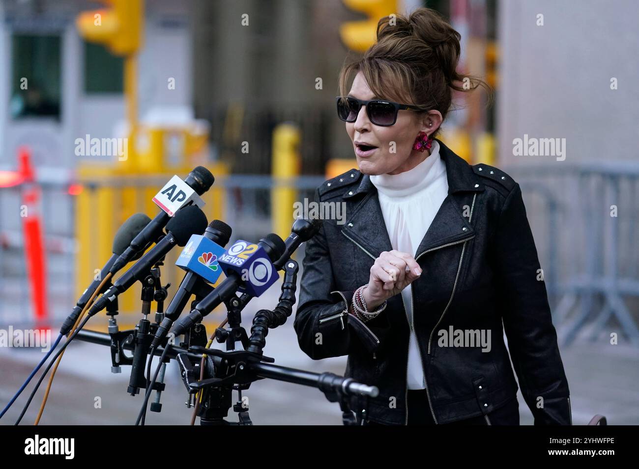 FILE - Former Alaska Gov. Sarah Palin speaks to reporters as she leaves ...