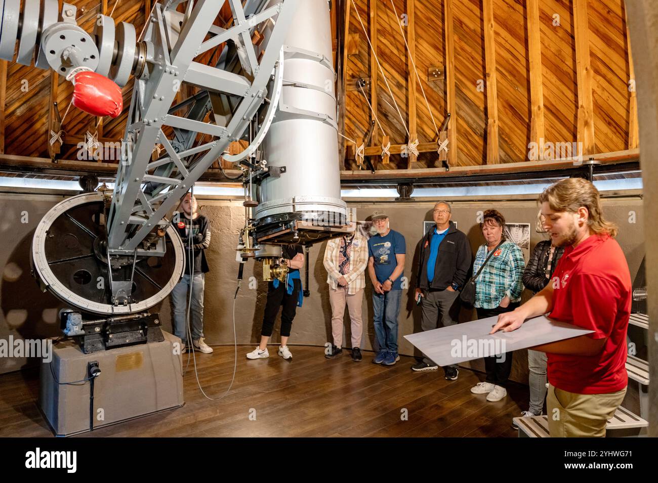 Tour guide explains the Pluto Discovery Telescope to visitors; Lowell ...