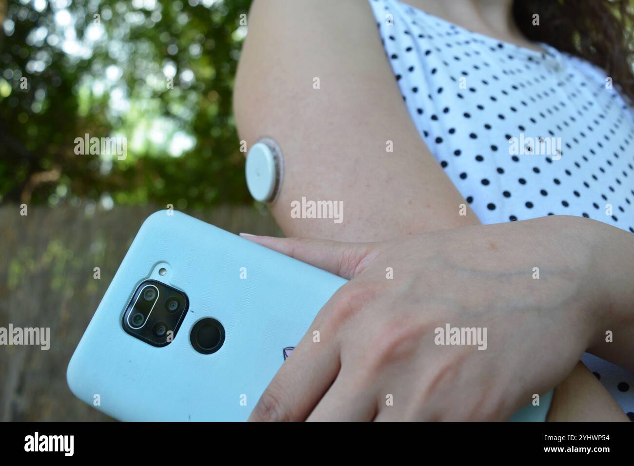 Modern Technology In Medicine Girl Use Application On Mobile Phone To Read Sensor For