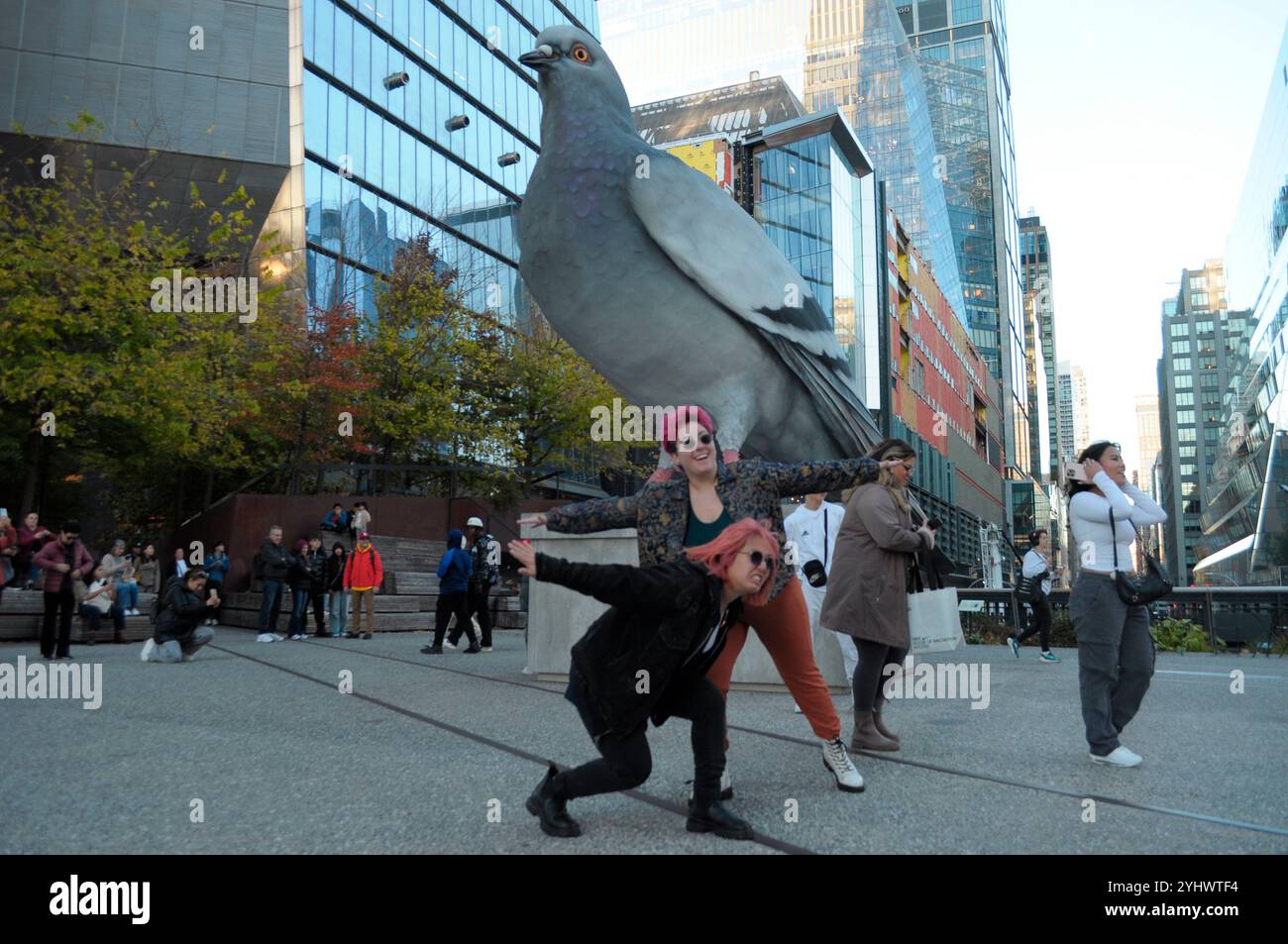New York, USA. 11th Nov, 2024. People pose in front of artist IvÃn ...